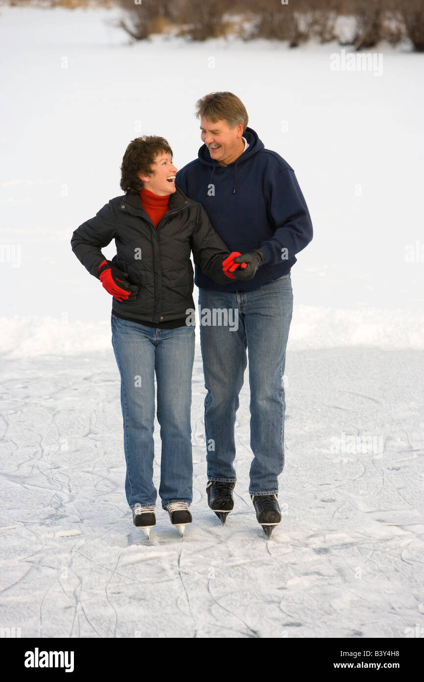 Couple ice skating together Stock Photo - Alamy
