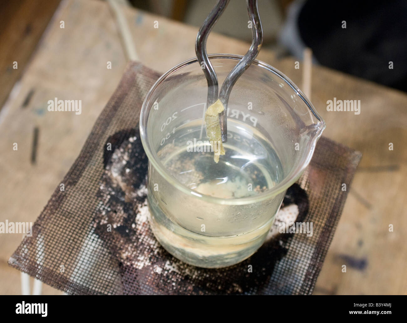 experiment taking place in a school classroom during a science lesson ...