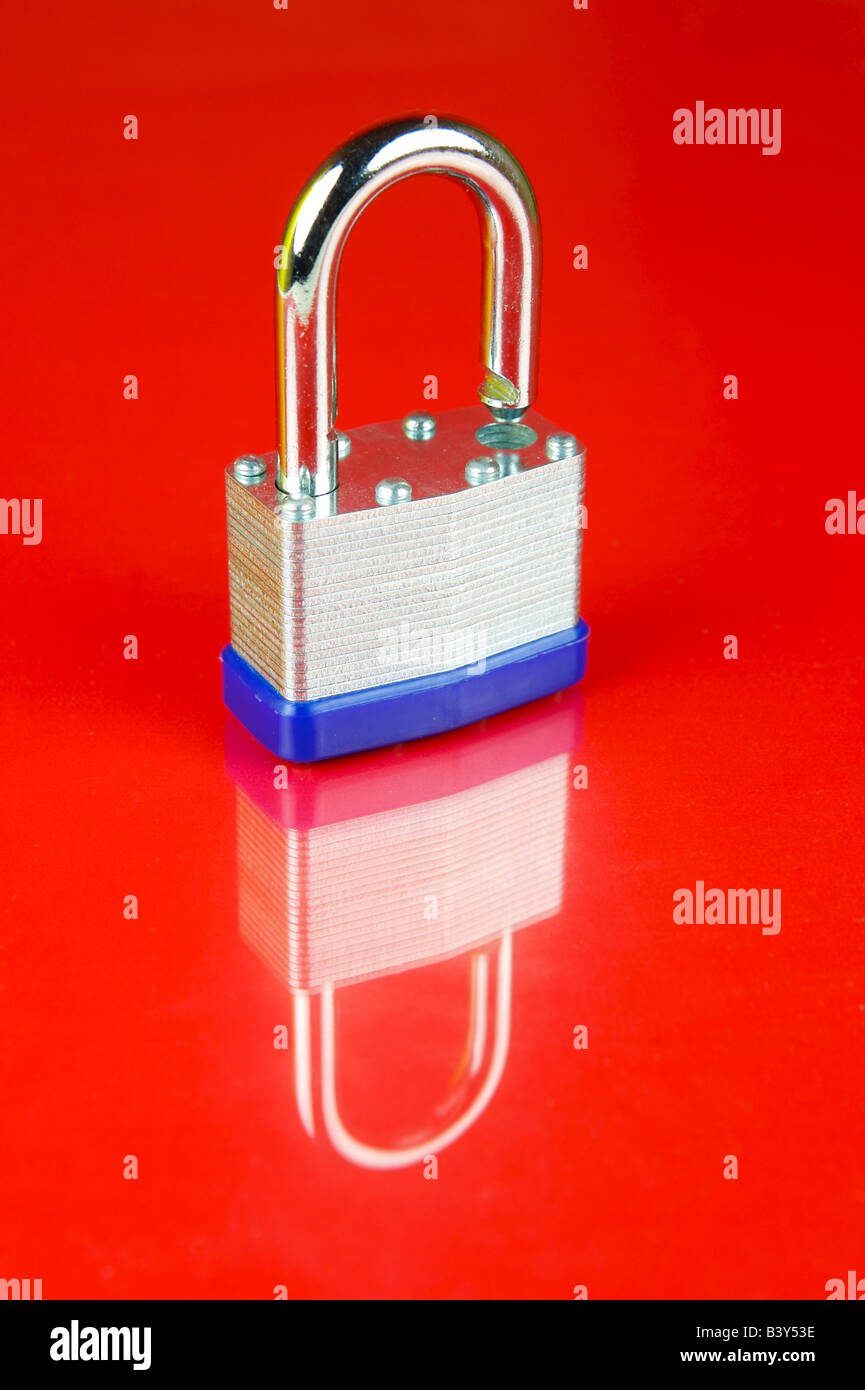 A padlock isolated against a red background Stock Photo - Alamy