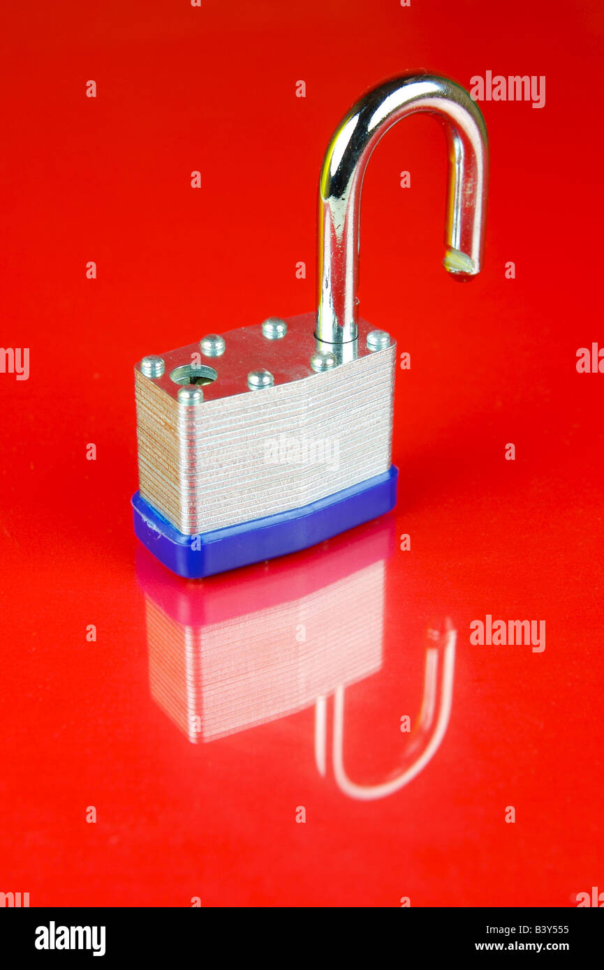 A padlock isolated against a red background Stock Photo - Alamy