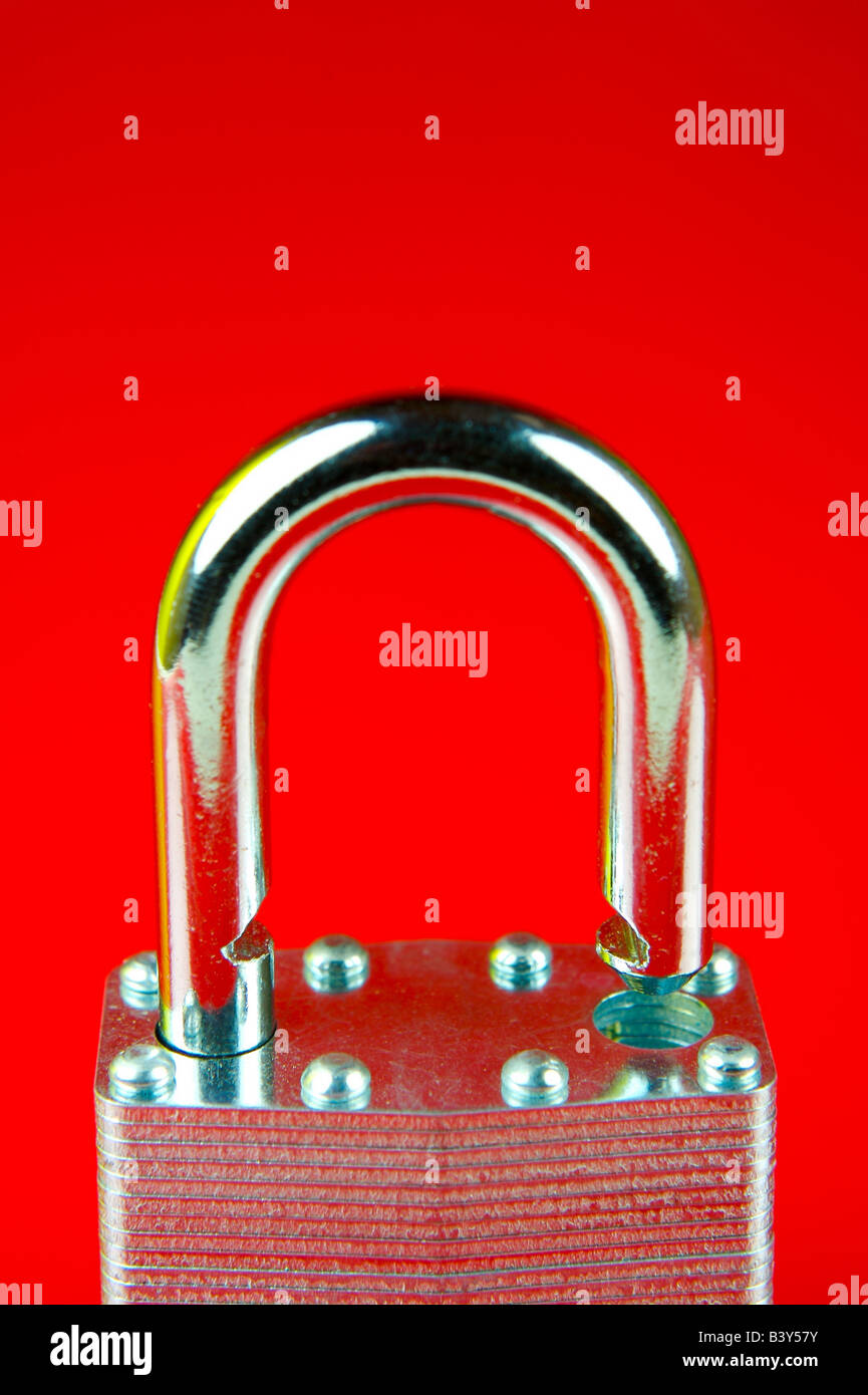 A padlock isolated against a red background Stock Photo - Alamy