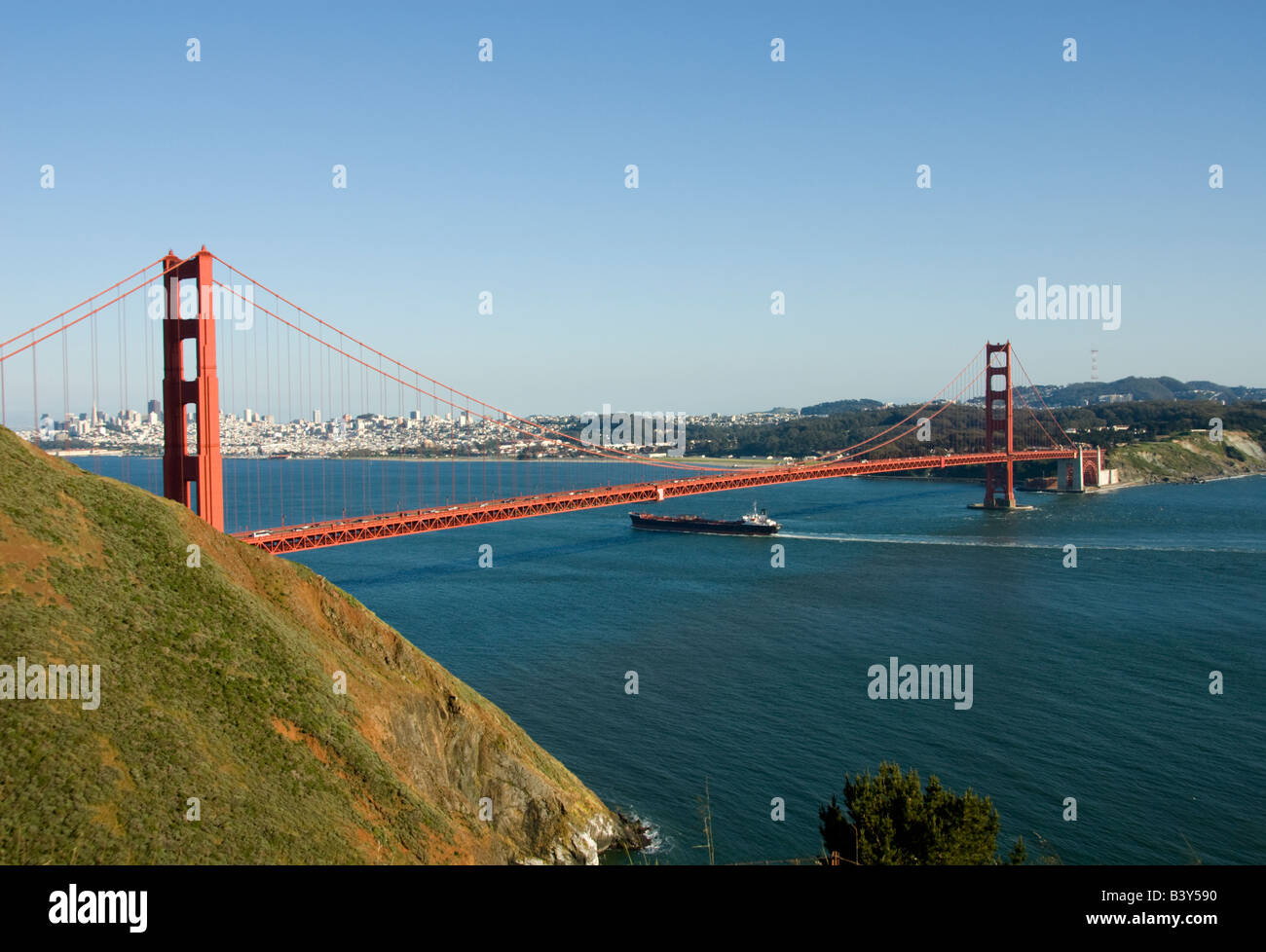 A ship passes under the Golden Gate Bridge in San Francisco CA ...