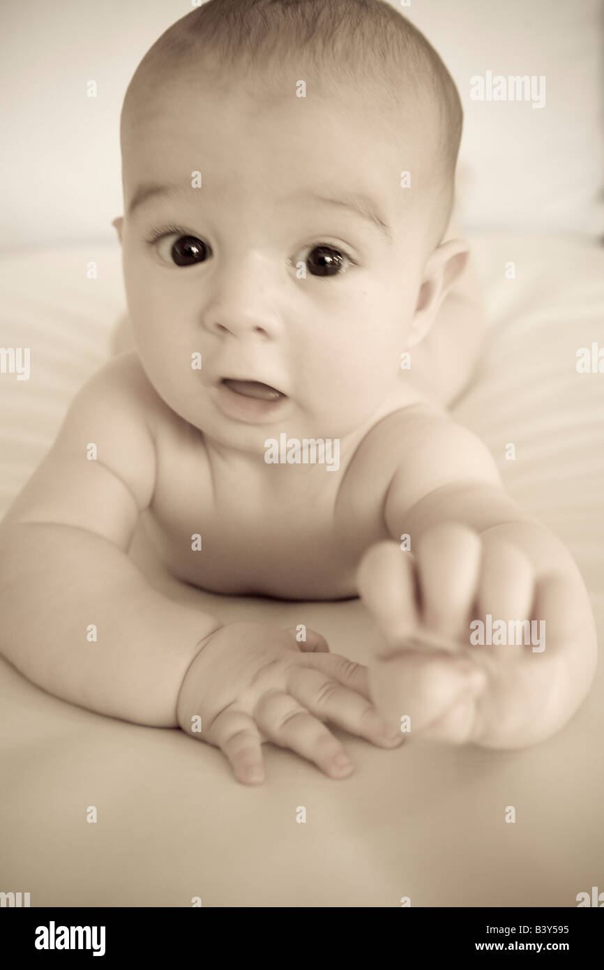 Baby Reaching Out Stock Photo - Alamy