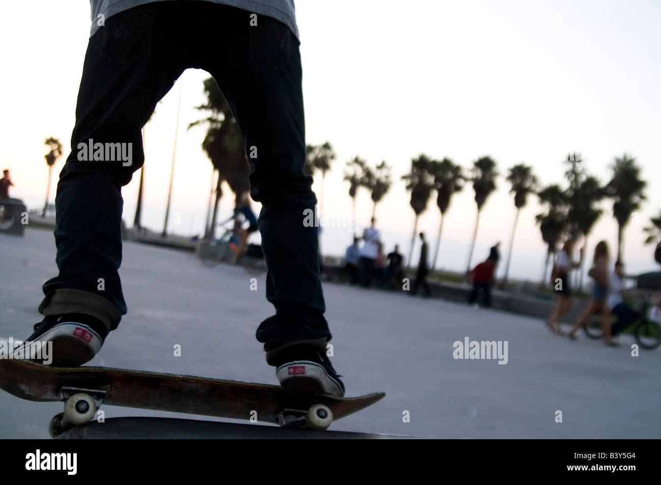 Skater caught from behind doing a trick Stock Photo - Alamy