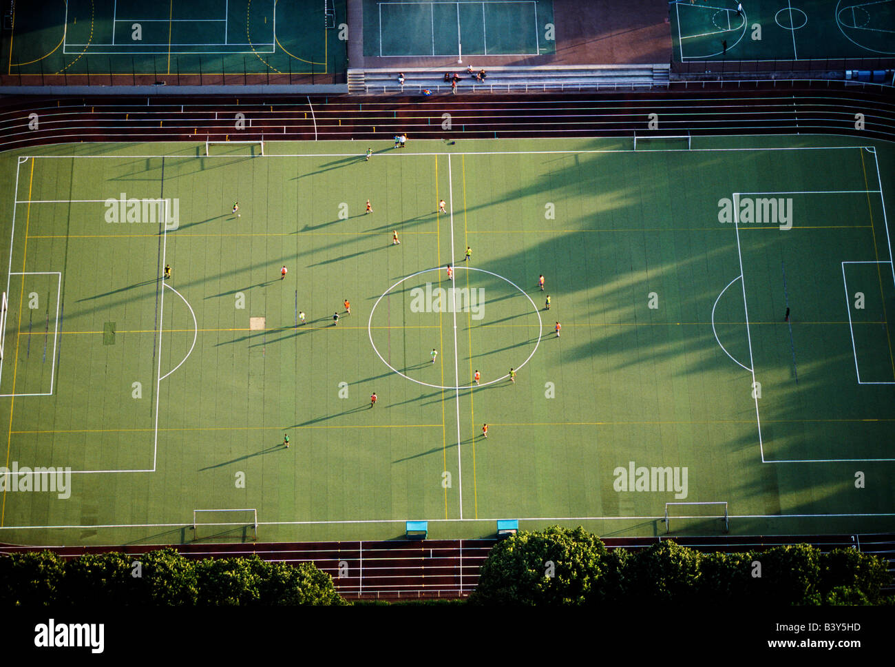 Summer view down on a soccer field and players from the Eiffel Tower ...