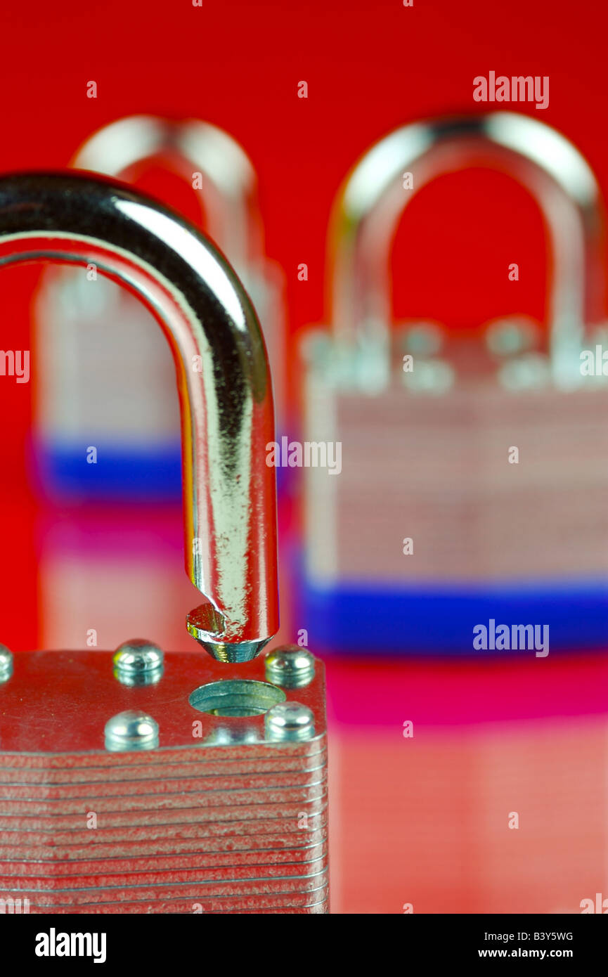 A padlock isolated against a red background Stock Photo - Alamy