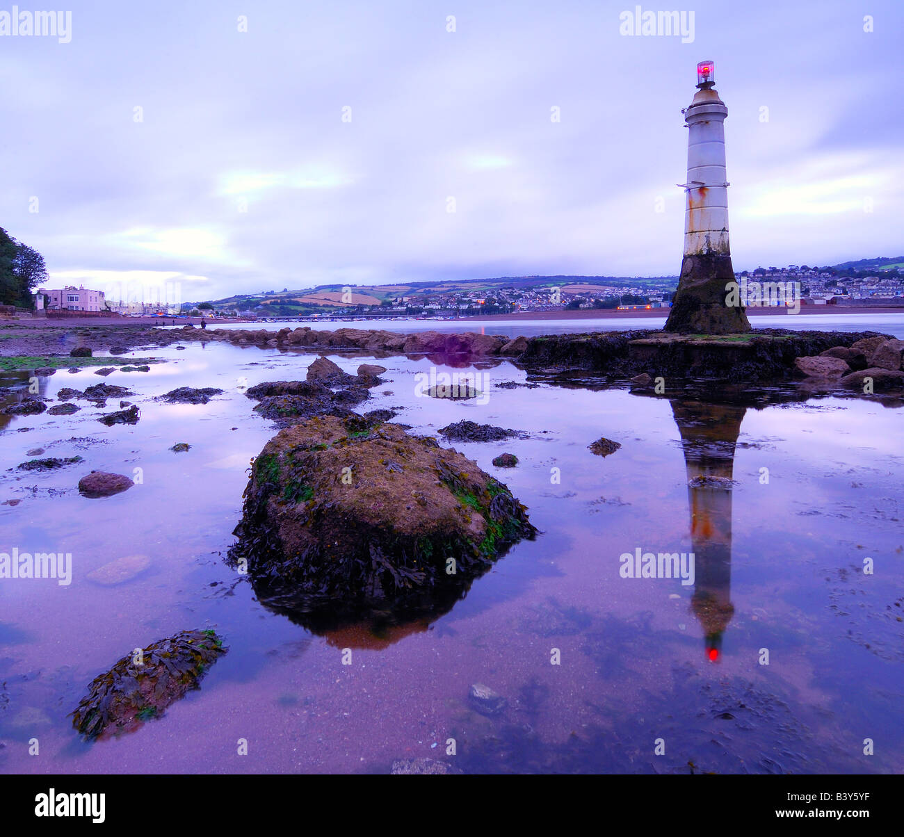 Just before dawn on Shaldon Beach below The Ness in South Devon with ...