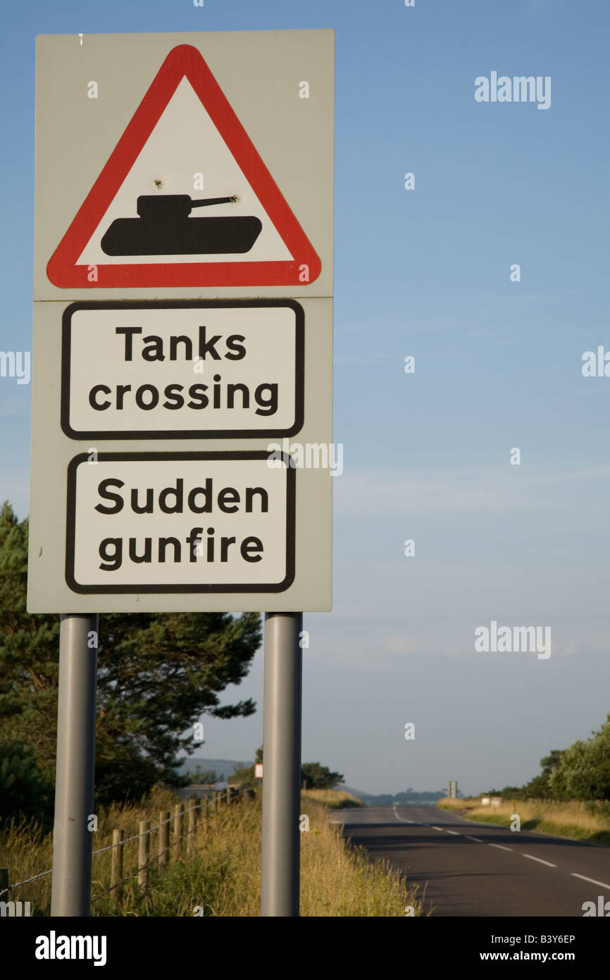 Warning sign for Tanks Crossing and Sudden Gunfire on road between ...