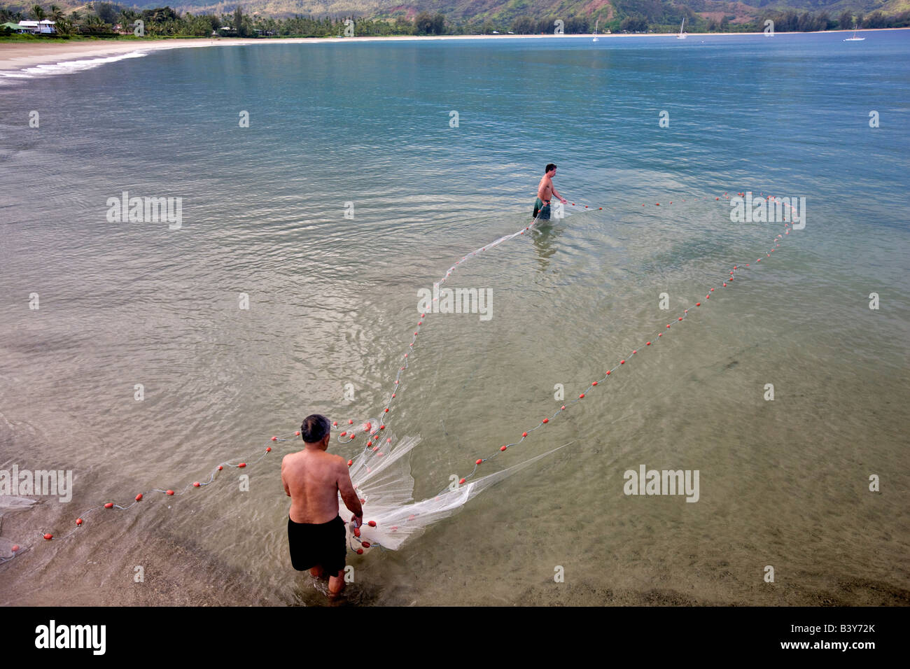Native hawaians net fishing for mackerel Hanalei Bay Kauai Hawaii Stock ...