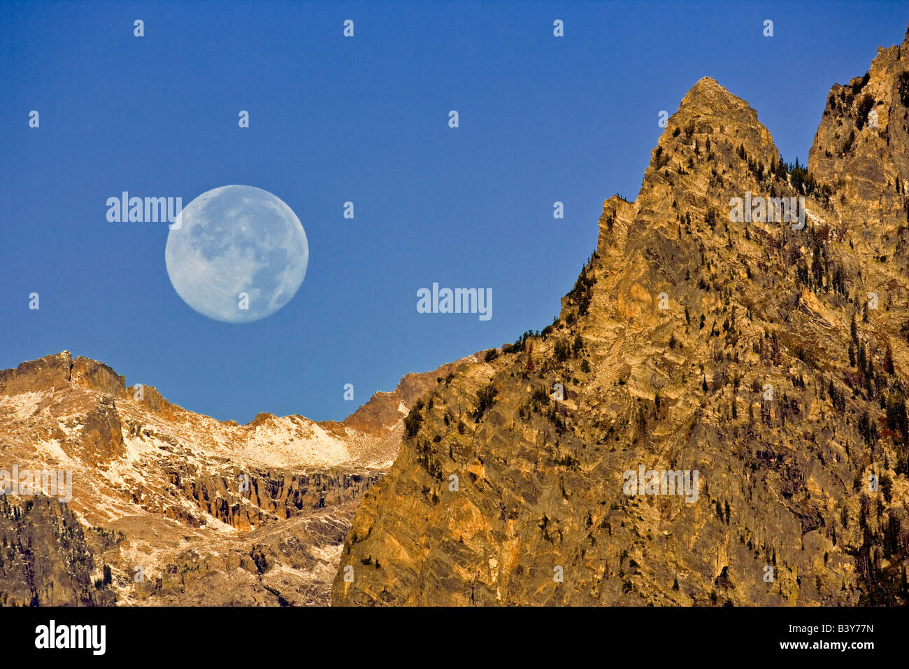 Full moonset over Teton Mountains Grand Teton National Park WY Stock ...