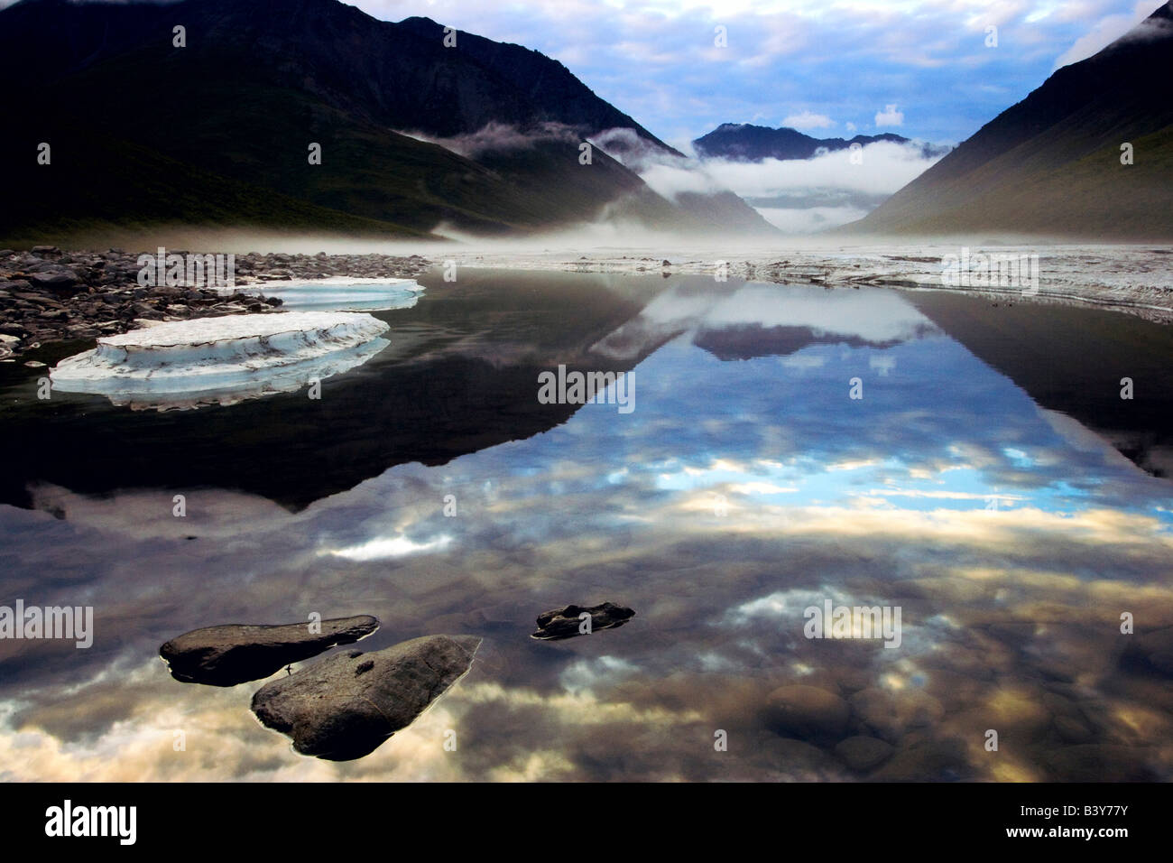 Fog forming in the Kongakut River valley as a storm passes at midnight ...