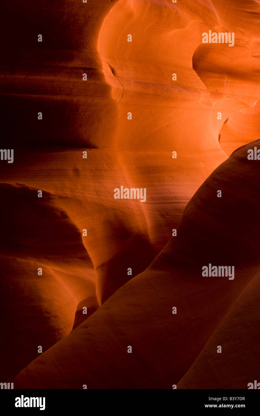 USA, Arizona, Navajo Tribal Lands. Reflected sunlights creates amber ...