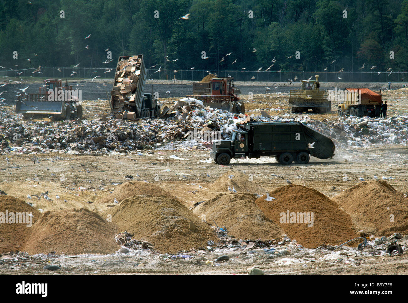 Trucks and heavy equipment working in a landfill in central New Jersey ...