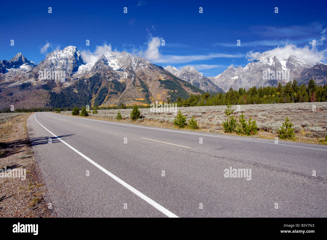 Road in Teton National Park with Teton Mountains WY Stock Photo - Alamy
