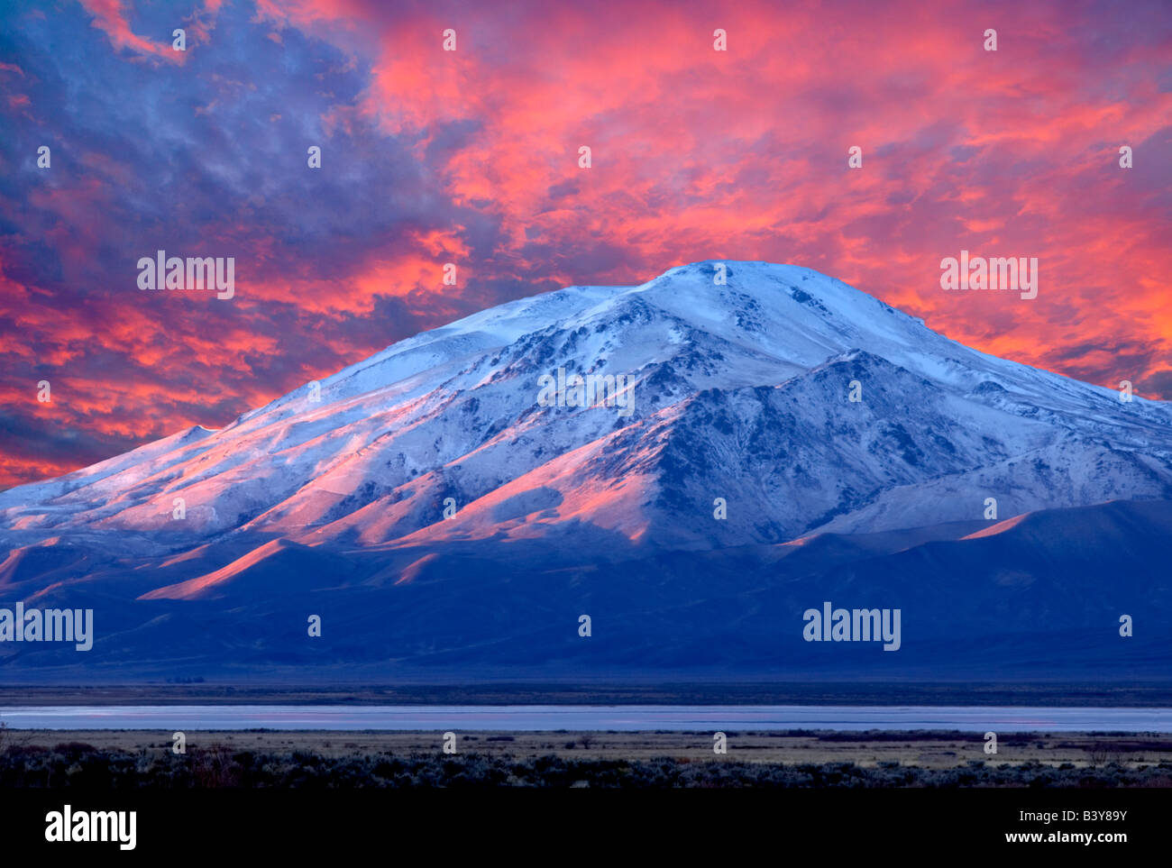 Pueblo Mountain at sunrise OregonClouds over Alpine Oregon Sky has been ...