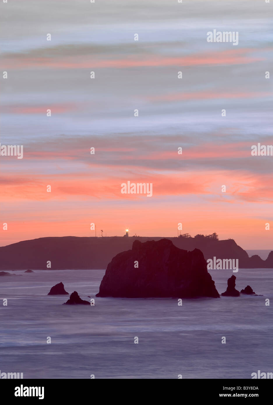 Sunset off Blacklock Point with Cape Blanco lighthouse Oregon Stock ...