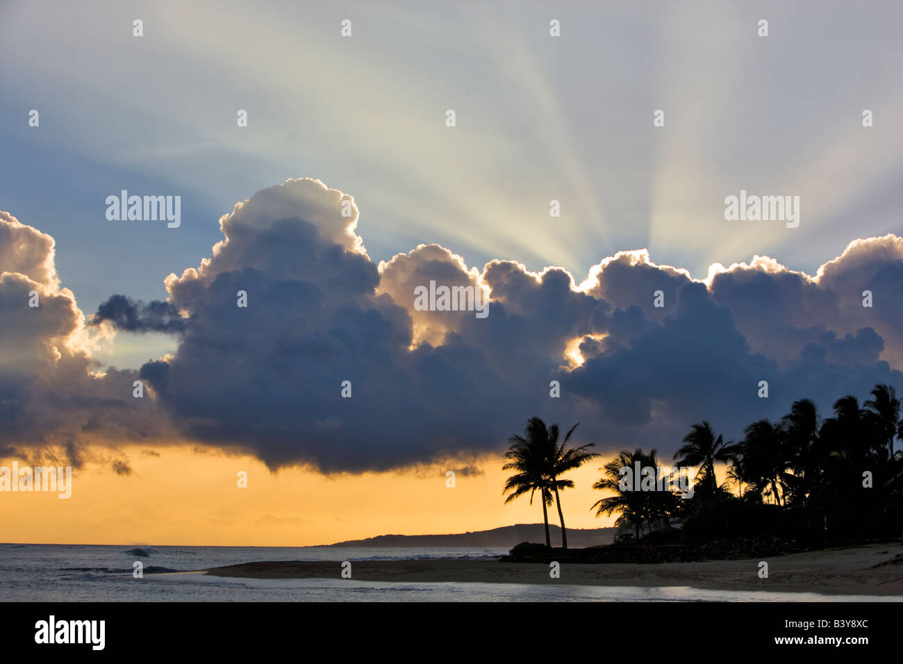 Sunset at Poipu Beach with rays of light Kauai Hawaii Stock Photo - Alamy