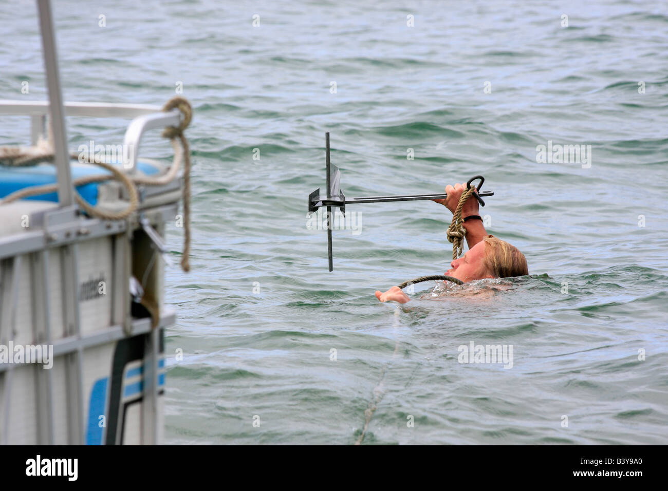 A young man anchoring the boat in USA US horizontal hi-res Stock Photo ...