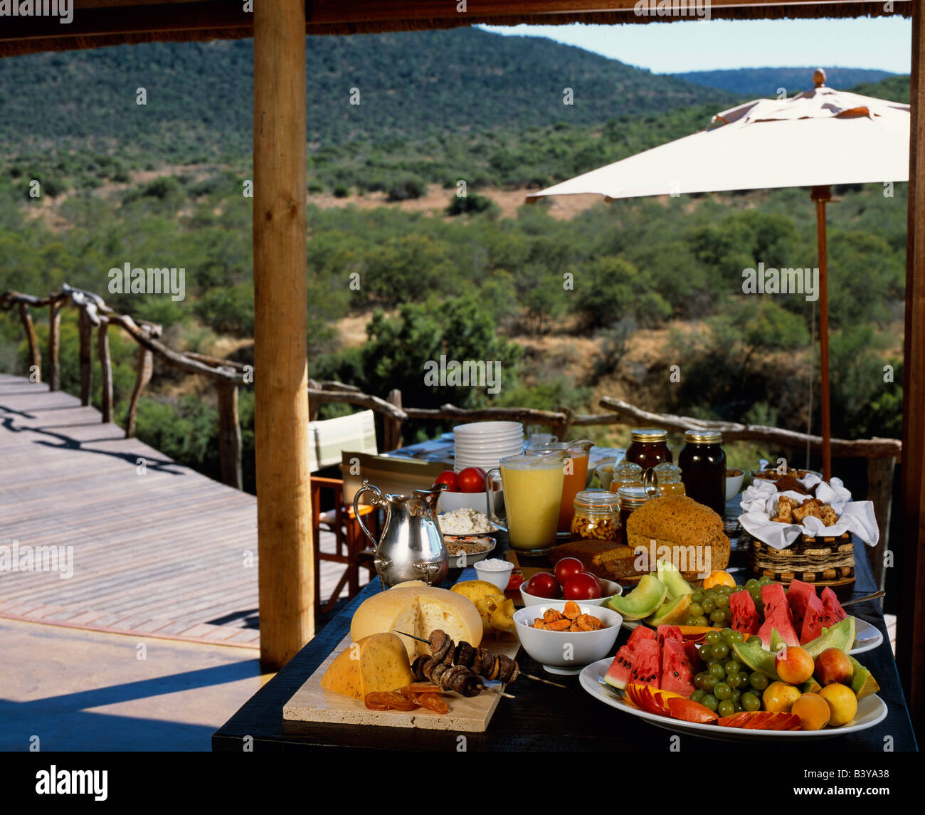 South Africa, Eastern Cape, Kwandwe. Breakfast on the deck at Kwandwe ...