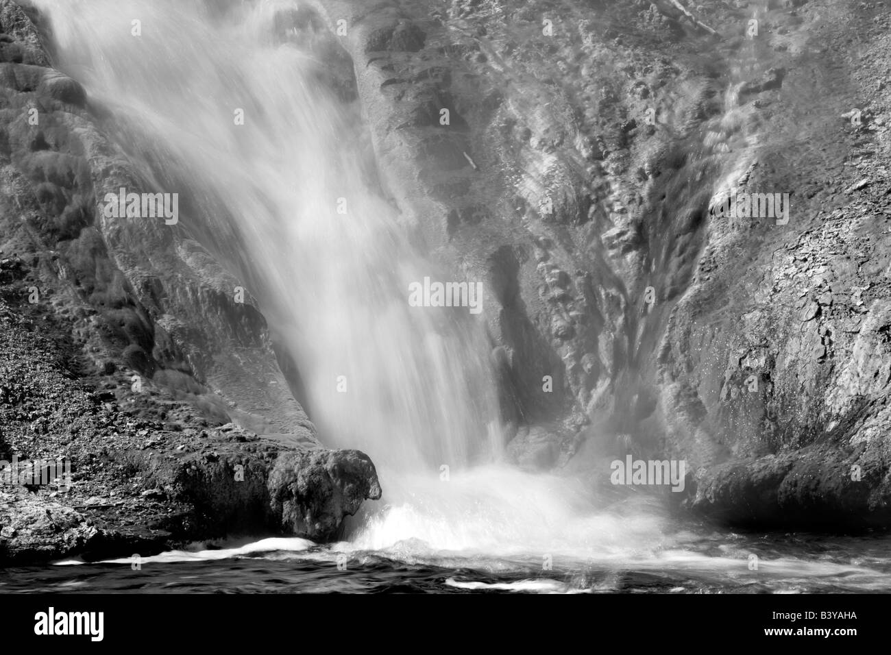 Hot springs waterfall flowing into the Firehole River Yellostone ...