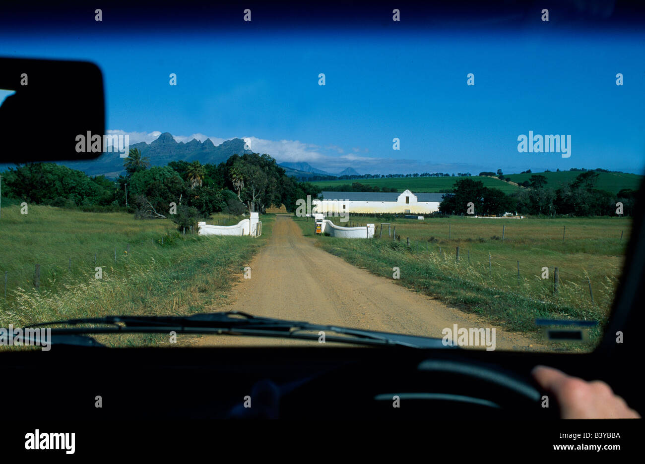 South Africa, Western Cape. View through windscreen of Cape Dutch ...