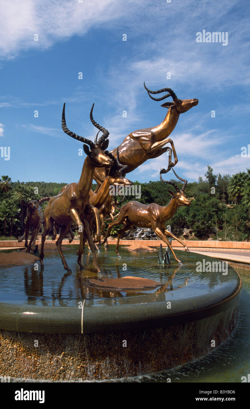 South Africa, Northwest Province, Sun City. Statue of jumping impala at ...