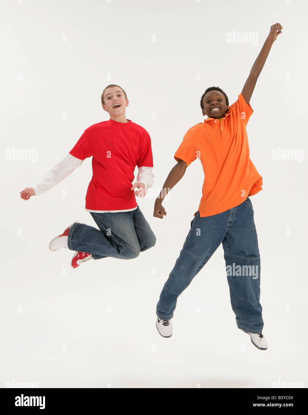Two boys jumping Stock Photo - Alamy
