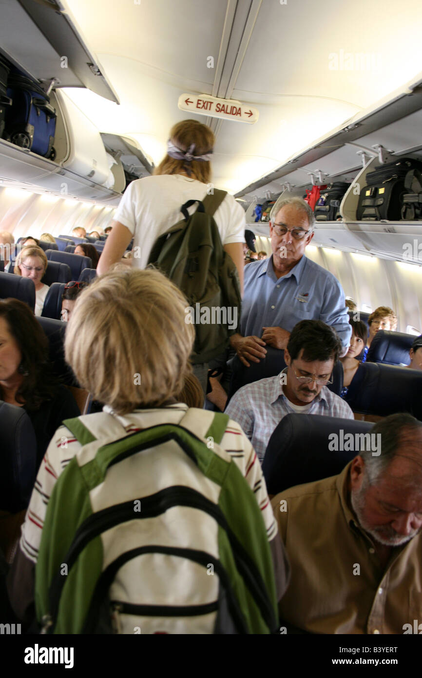 Airplane seat crowded hi-res stock photography and images - Alamy