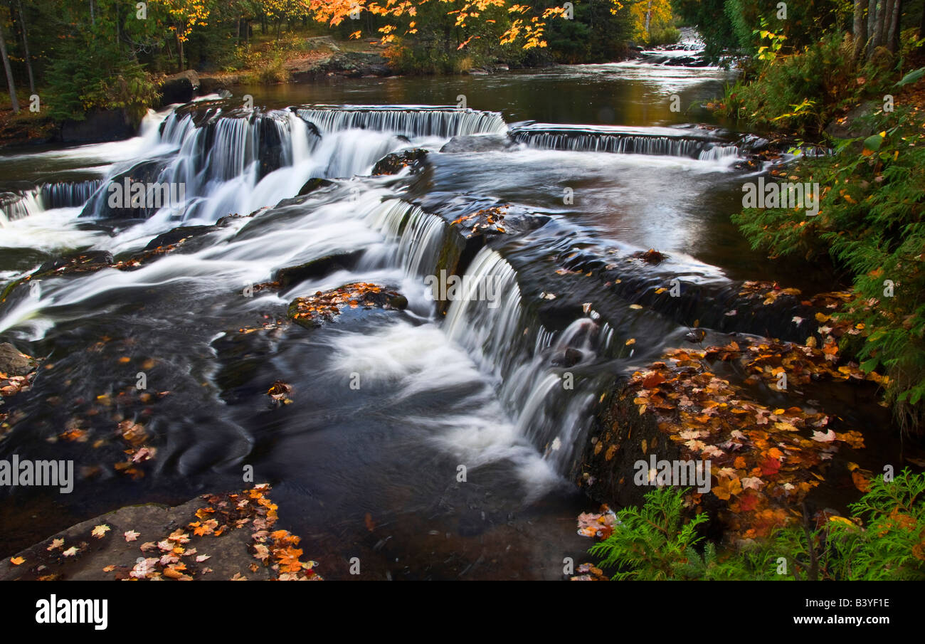 USA, Michigan, Upper Peninsula. Bond Falls and fall foliage Stock Photo ...