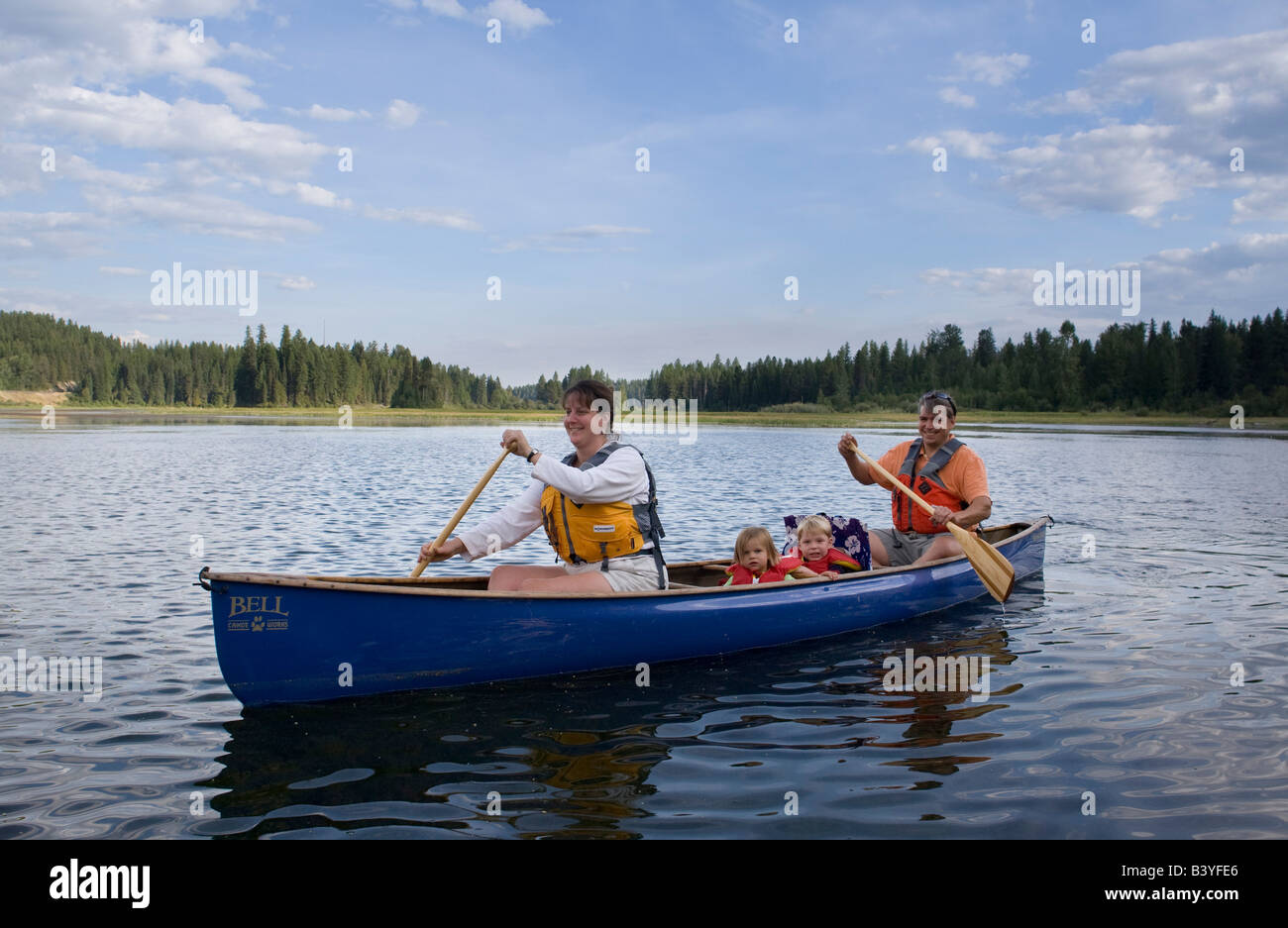 Family canoeing on Upper Stillwater Lake in Montana model released ...