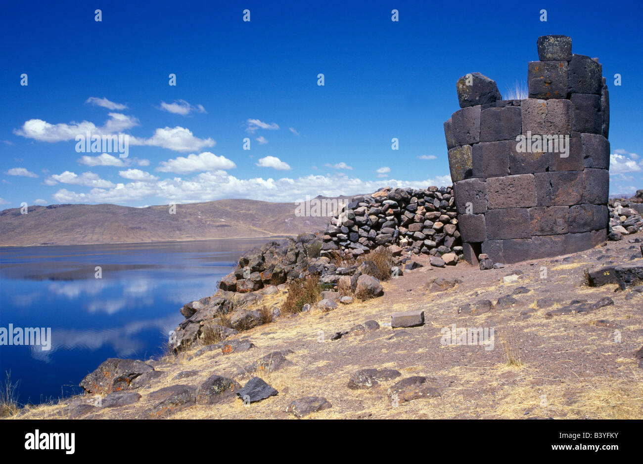 Peru, Puno, Sillustani. Chullpa (Inca burial chamber) with Lake Umayo ...