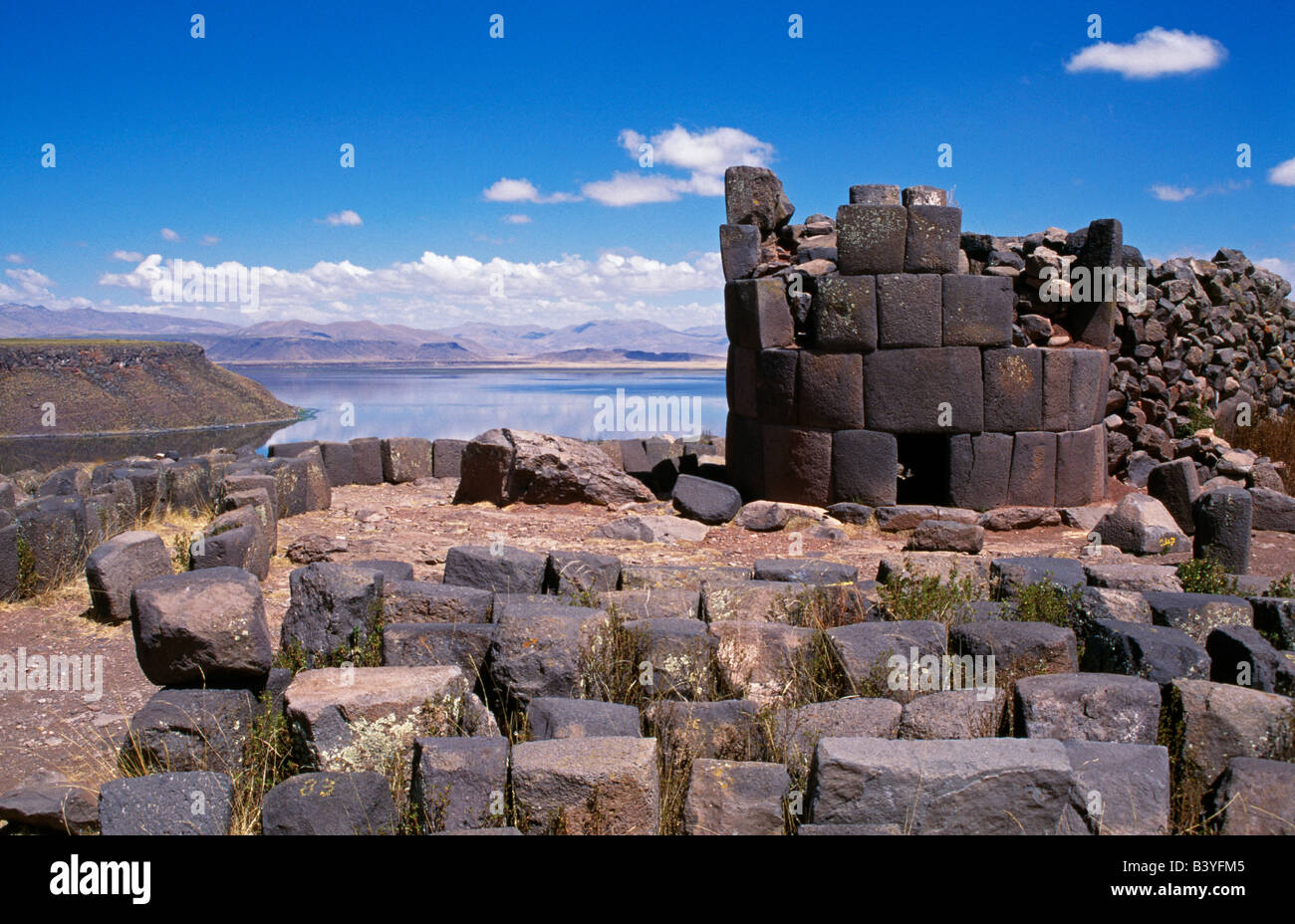 Peru, Puno, Sillustani. Chullpa (Inca burial chamber) with Lake Umayo ...