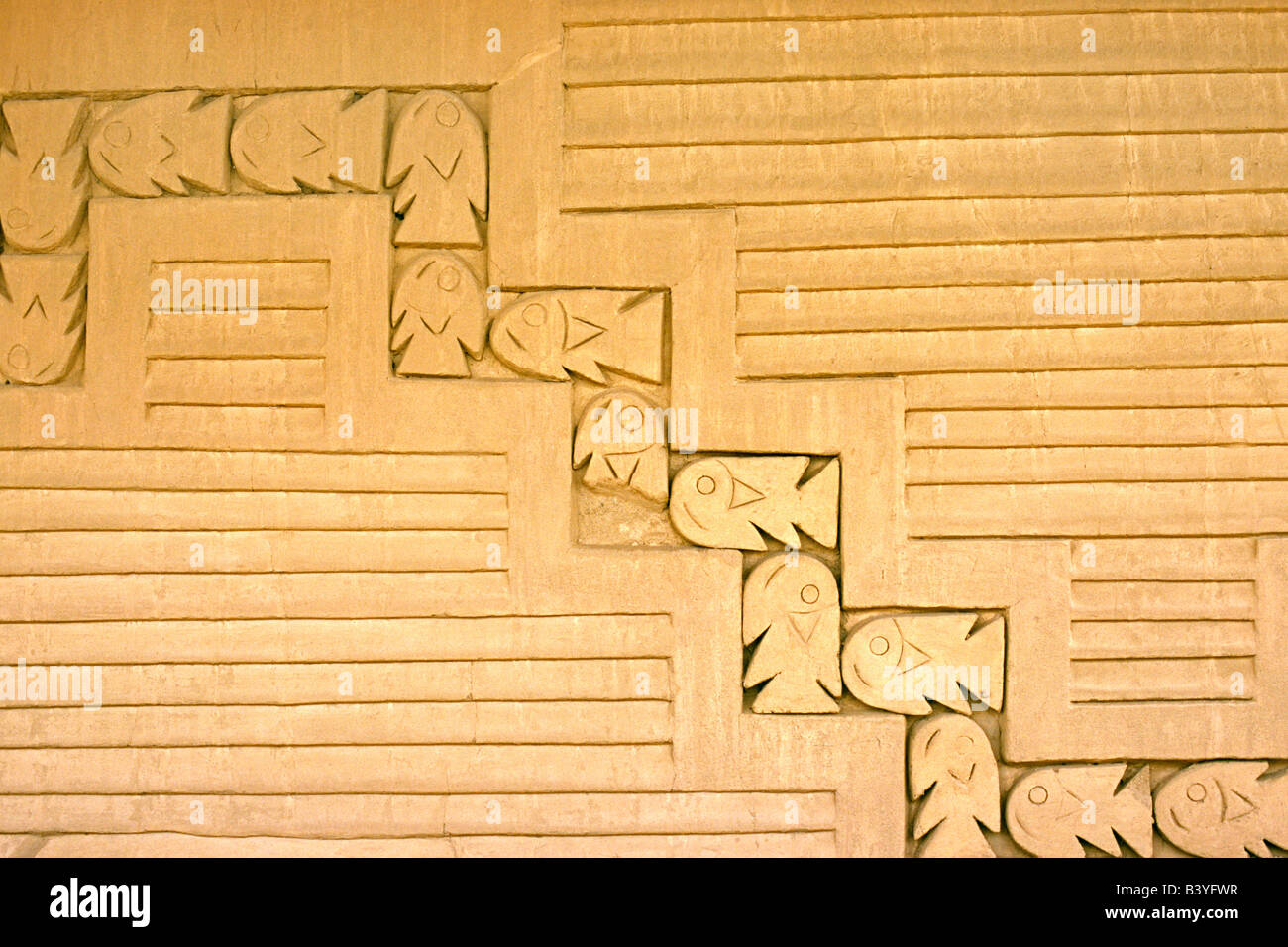 Peru, Trujillo, Chan Chan. Adobe wall frieze incorporating a fish and ...