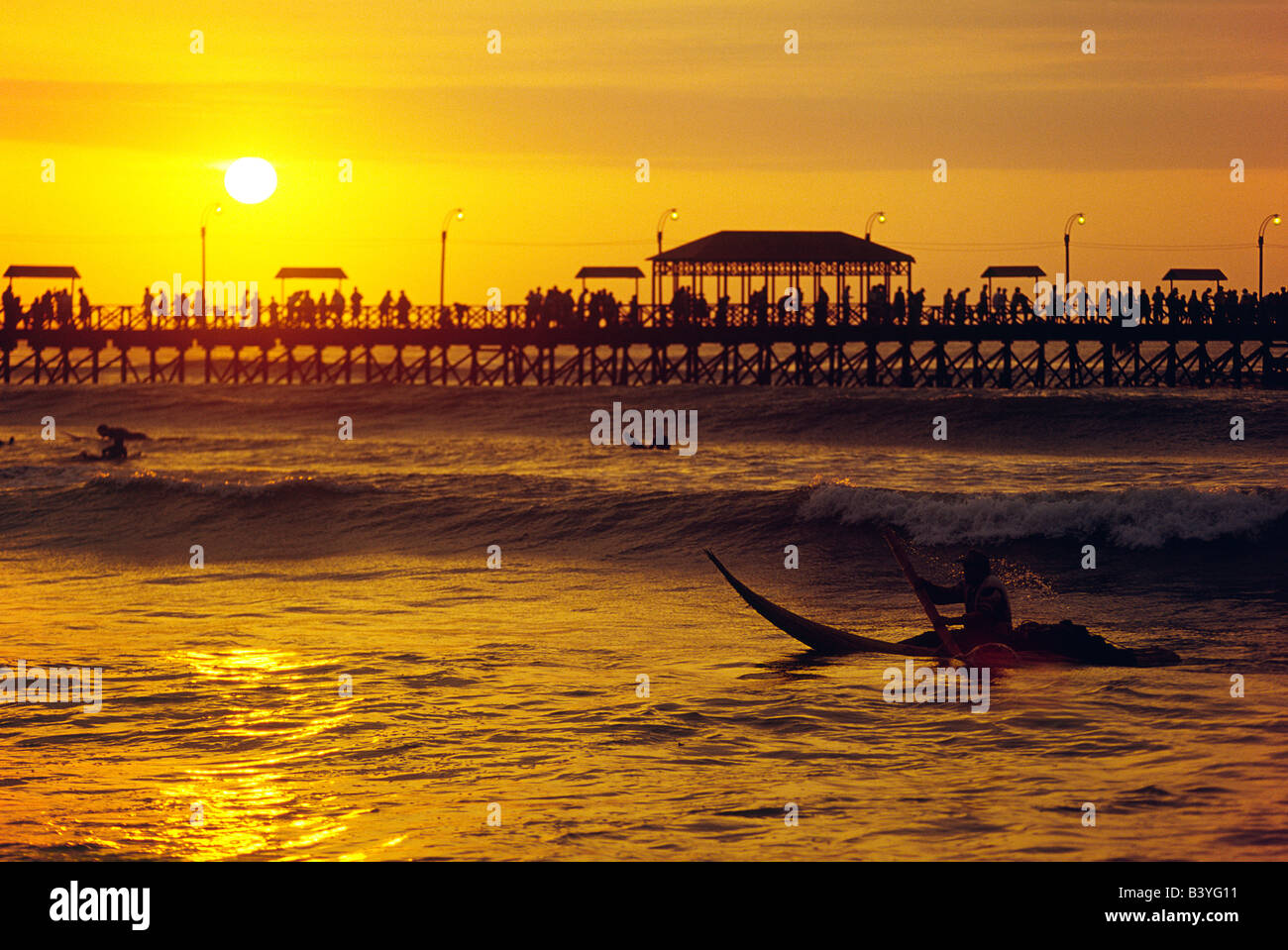 Peru, La Libertad, Huanchaco. A pescador (fisherman) waits to ride a ...