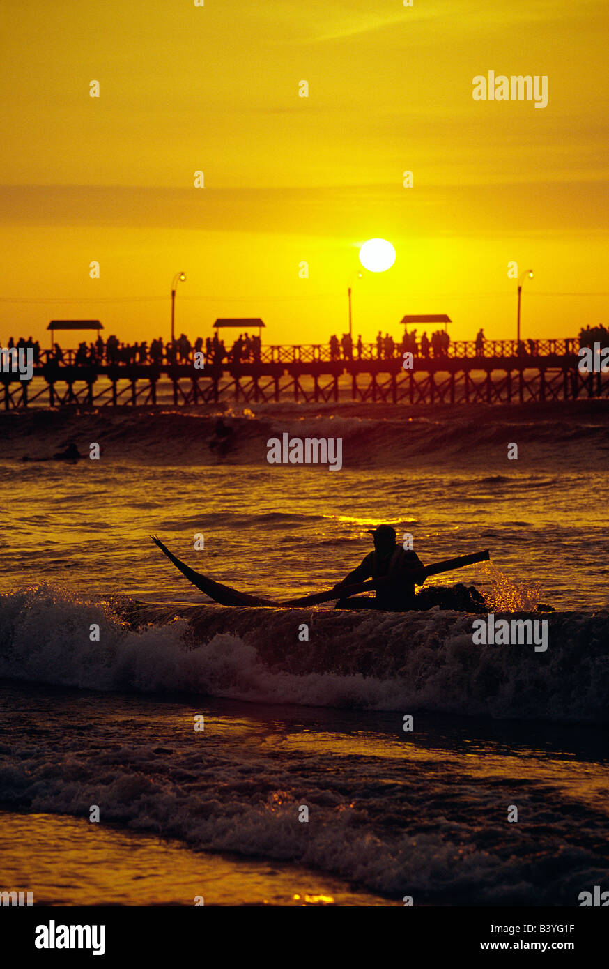 Peru, La Libertad, Huanchaco. A pescador (fisherman) waits to ride a ...
