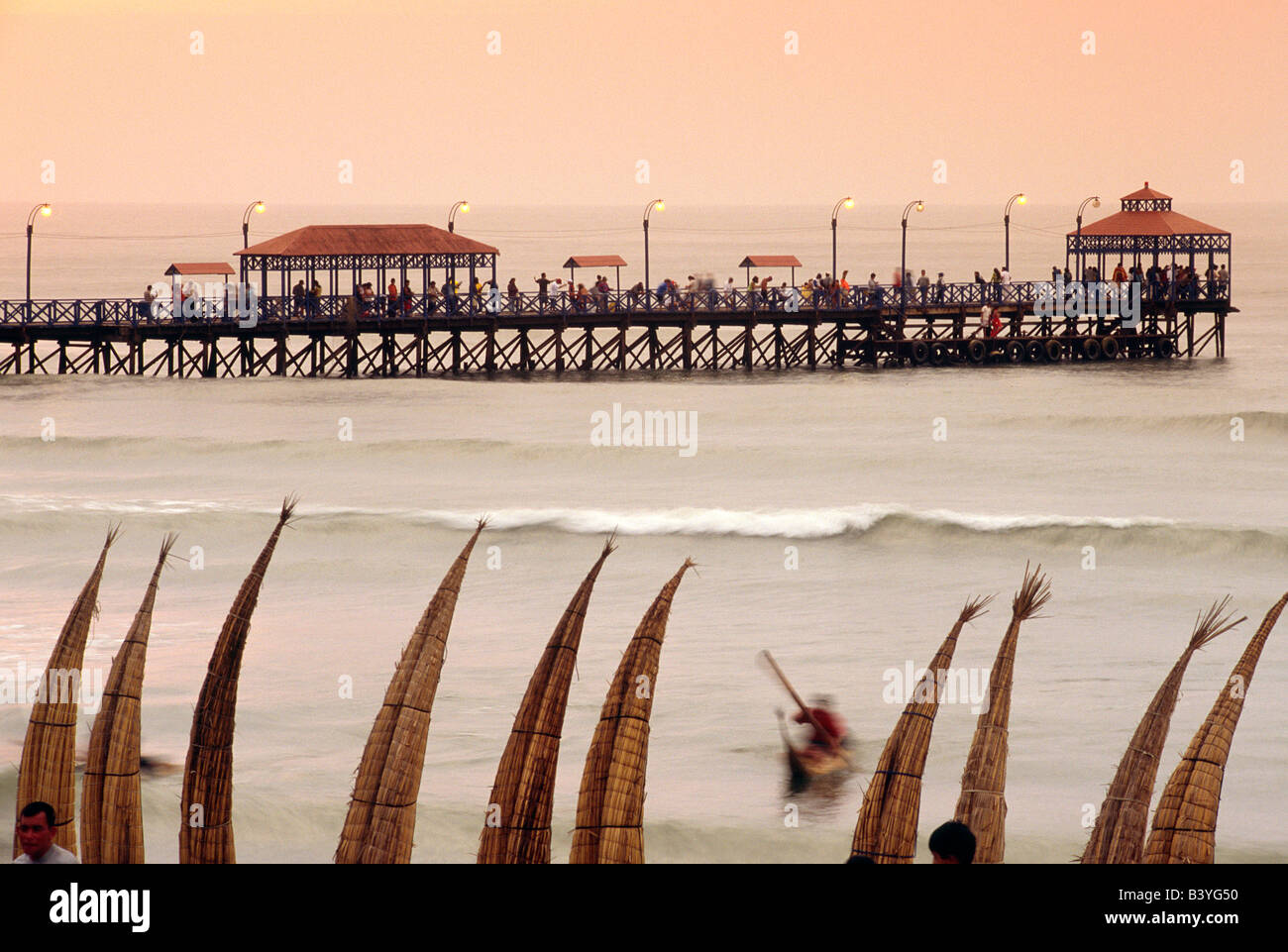 Peru, La Libertad, Huanchaco. A busy scene on the waterfront at ...