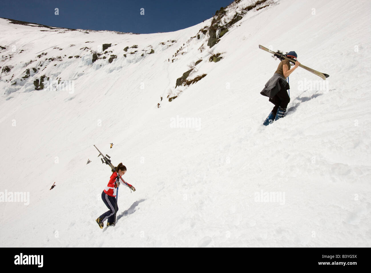 Skiers climbing Tuckerman Ravine in New Hampshire's White Mountains ...