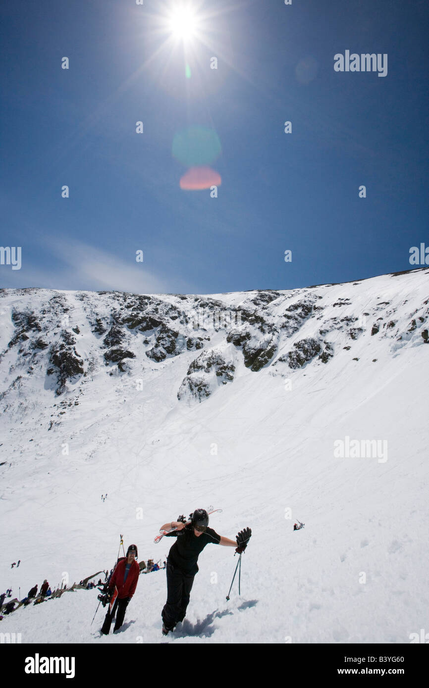 Skiers climbing Tuckerman Ravine in New Hampshire's White Mountains ...