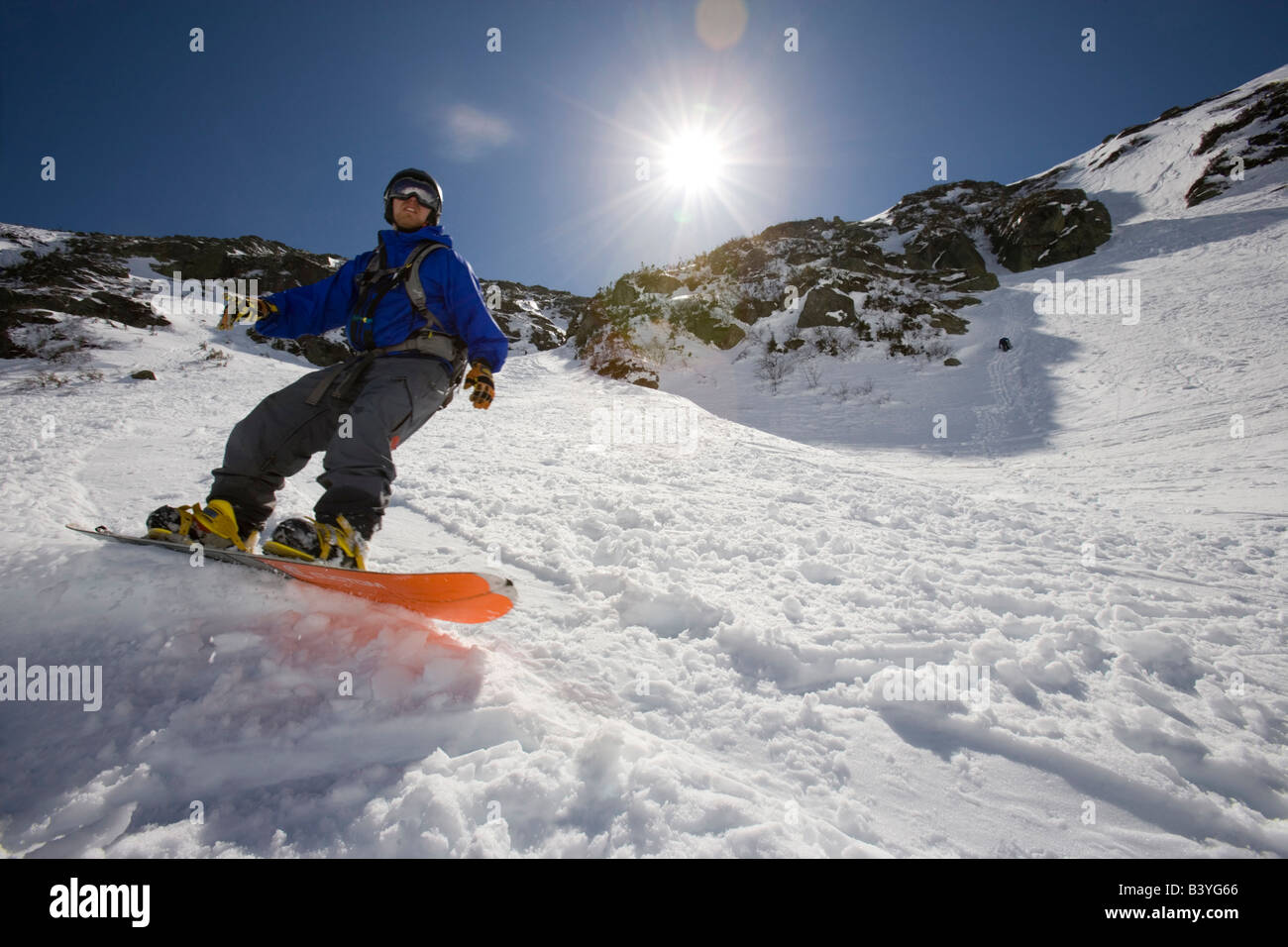 A snowboarder in Tuckerman Ravine in New Hampshire's White Mountains ...