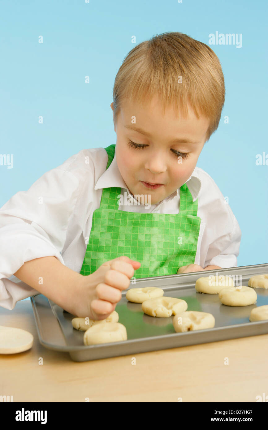 Boy making cookies Stock Photo - Alamy