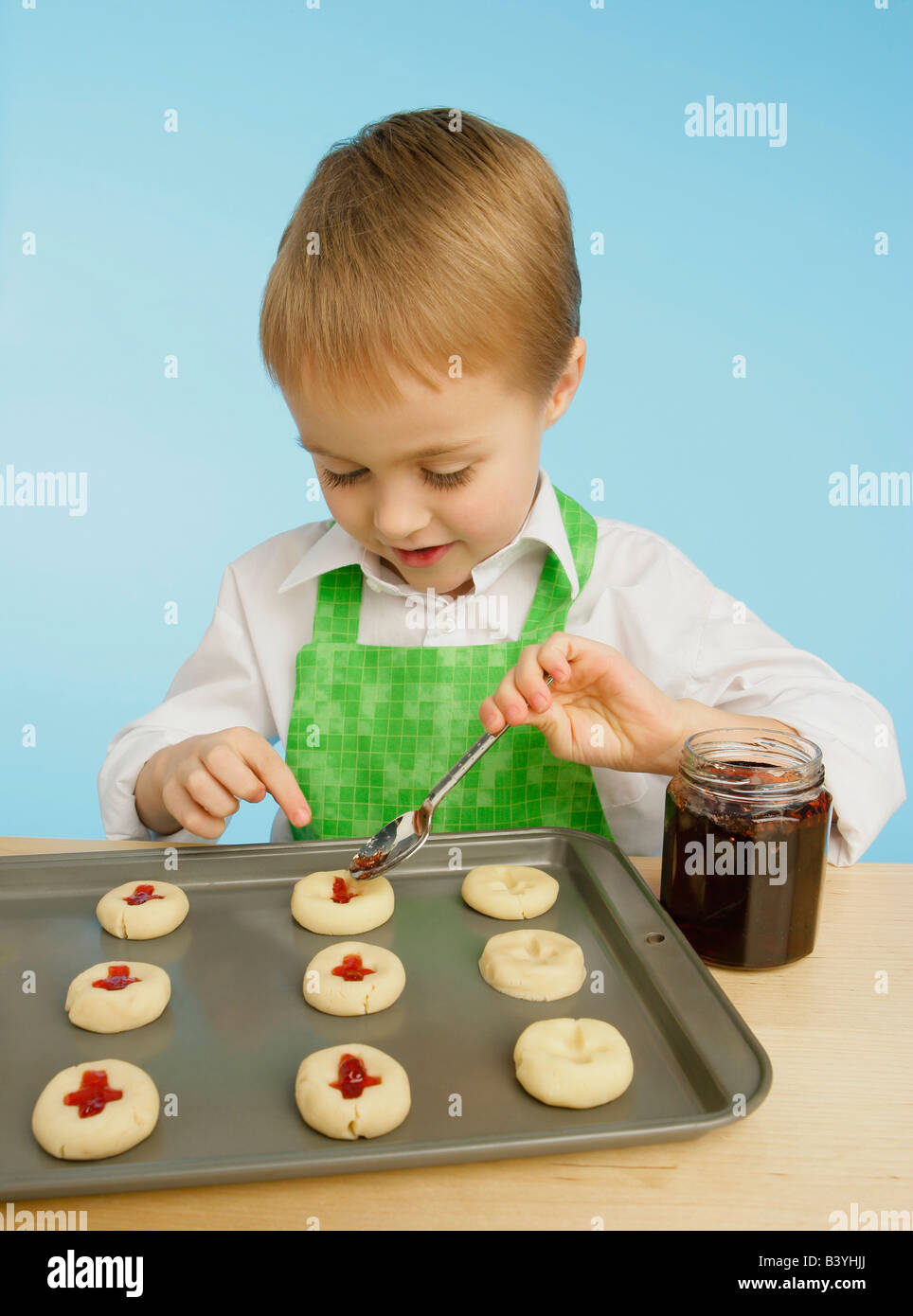Boy making cookies Stock Photo - Alamy