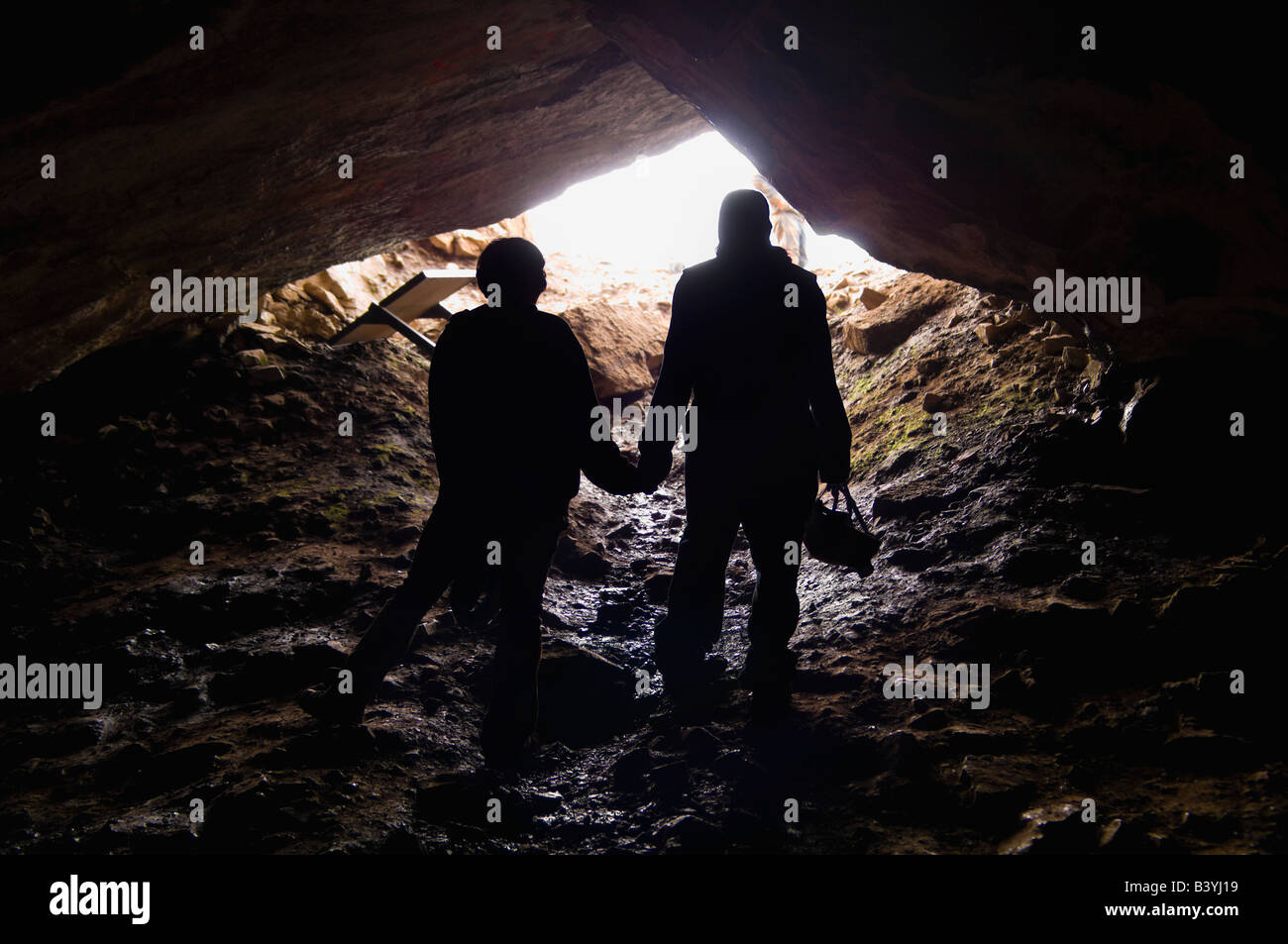 Silhouette of two climbers in cave hi-res stock photography and images ...