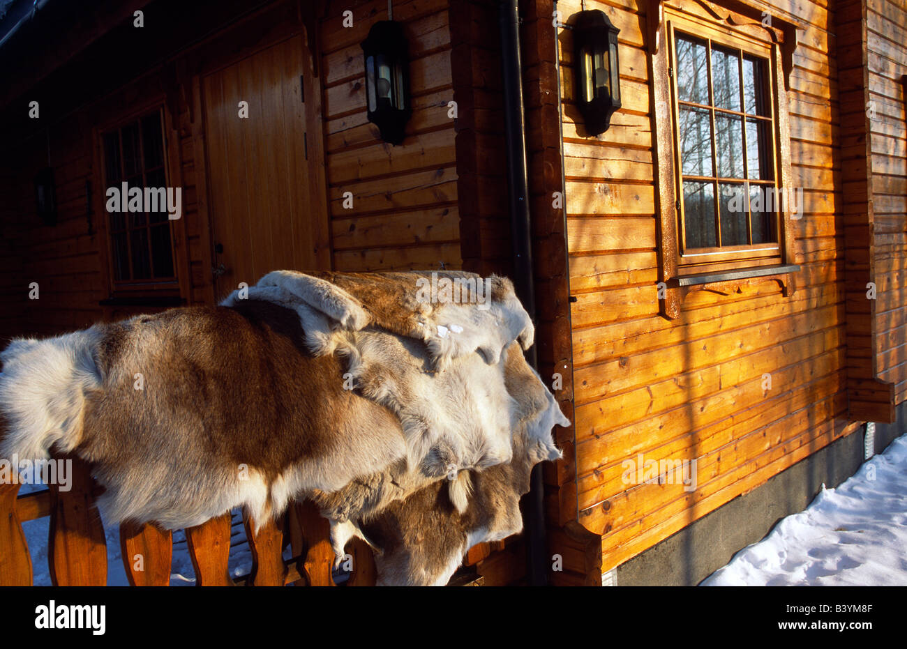 Reindeer skins on the balcony of wooden cabin at the Gargia Fjellstue ...