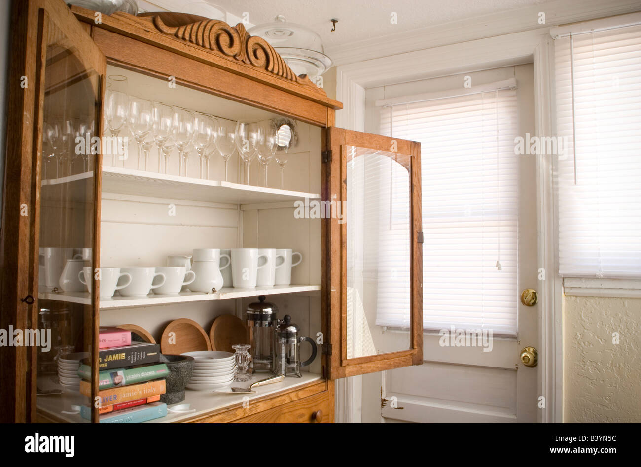 Antique cupboard with contemporary kitchen items Stock Photo - Alamy
