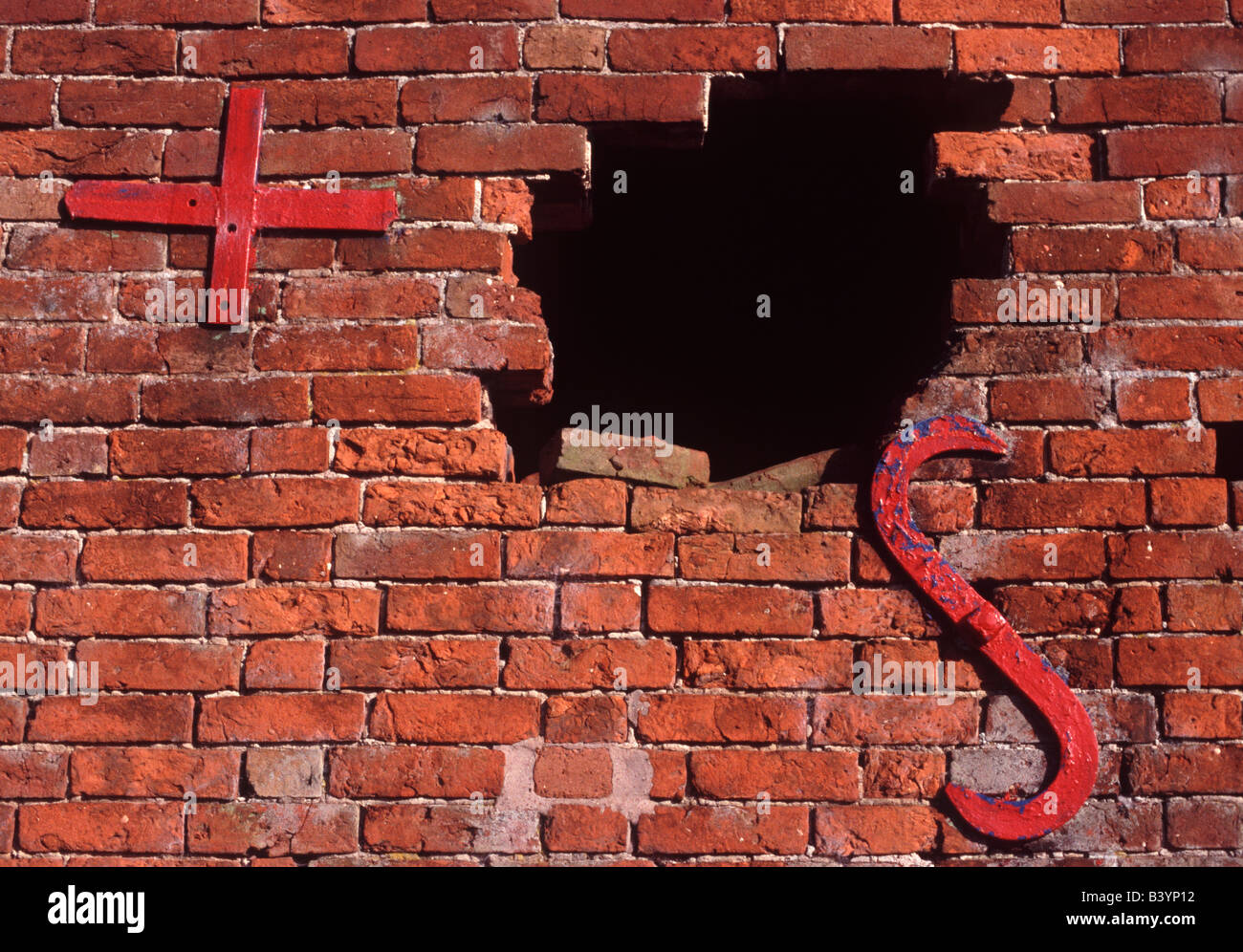 Cross and S shaped reinforcing rod ends supporting a deteriorating old ...