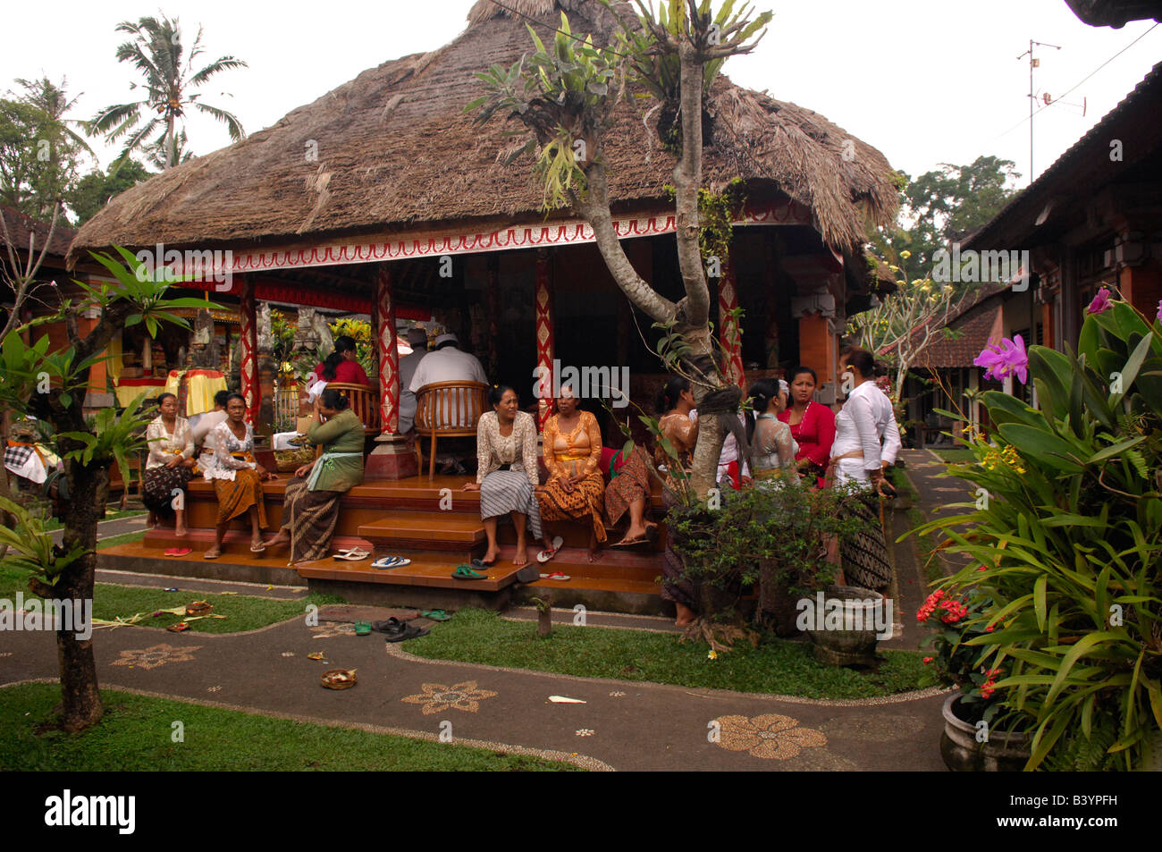 balinese family gathering during galungan festival at family shrine and ...
