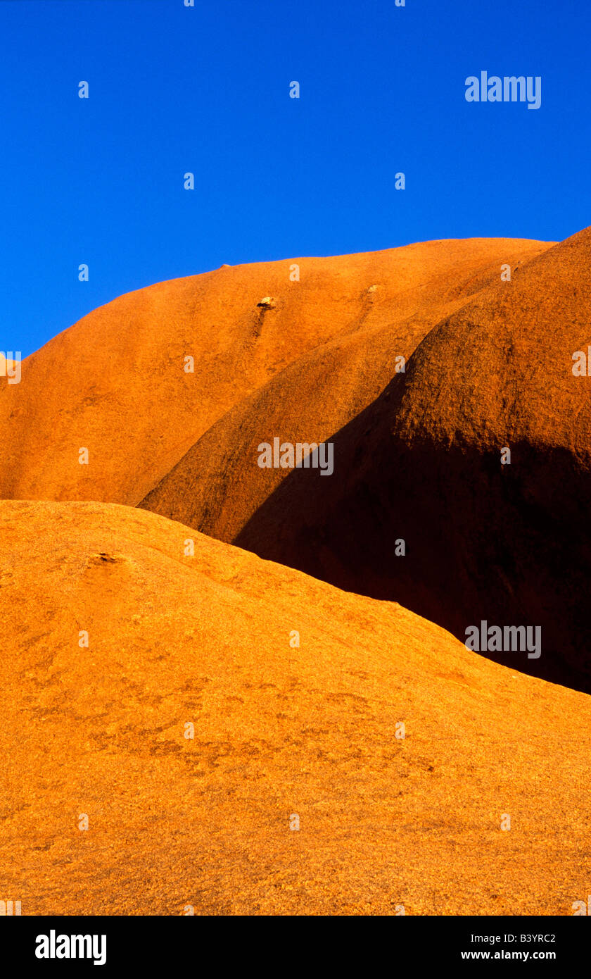 Namibia, Damaraland, Spitzkoppe. Orange red granite cliffs at sunset ...