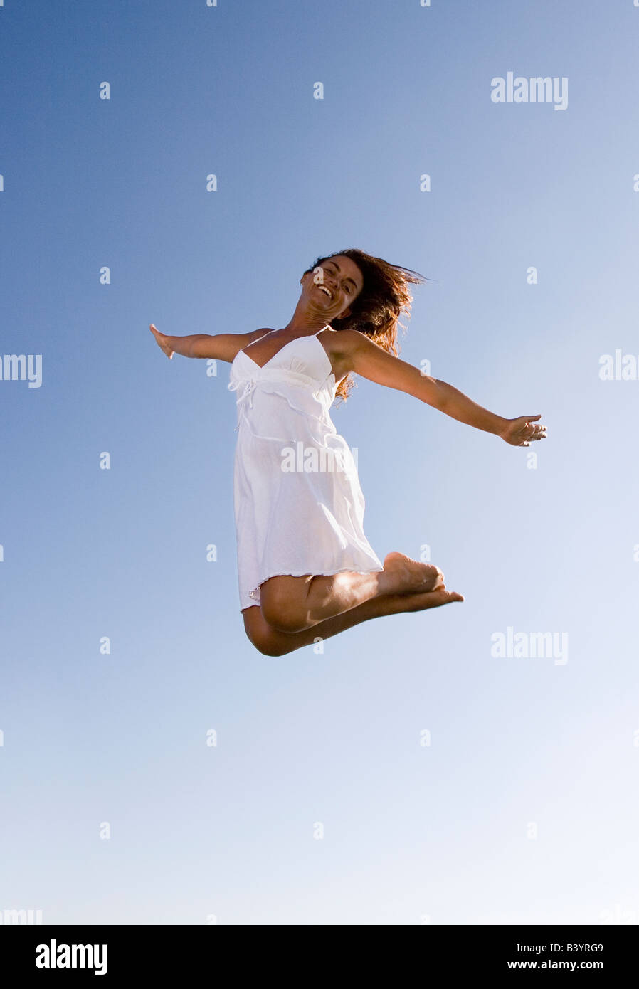 Girl jumping free air Stock Photo - Alamy