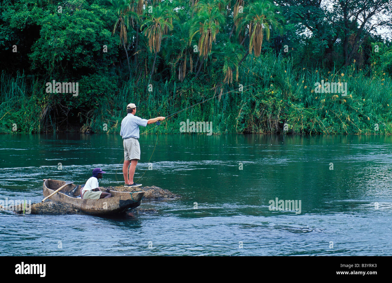 Namibia, Caprivi Strip, Zambezi River. Rupert StAubyn flyfishing for ...