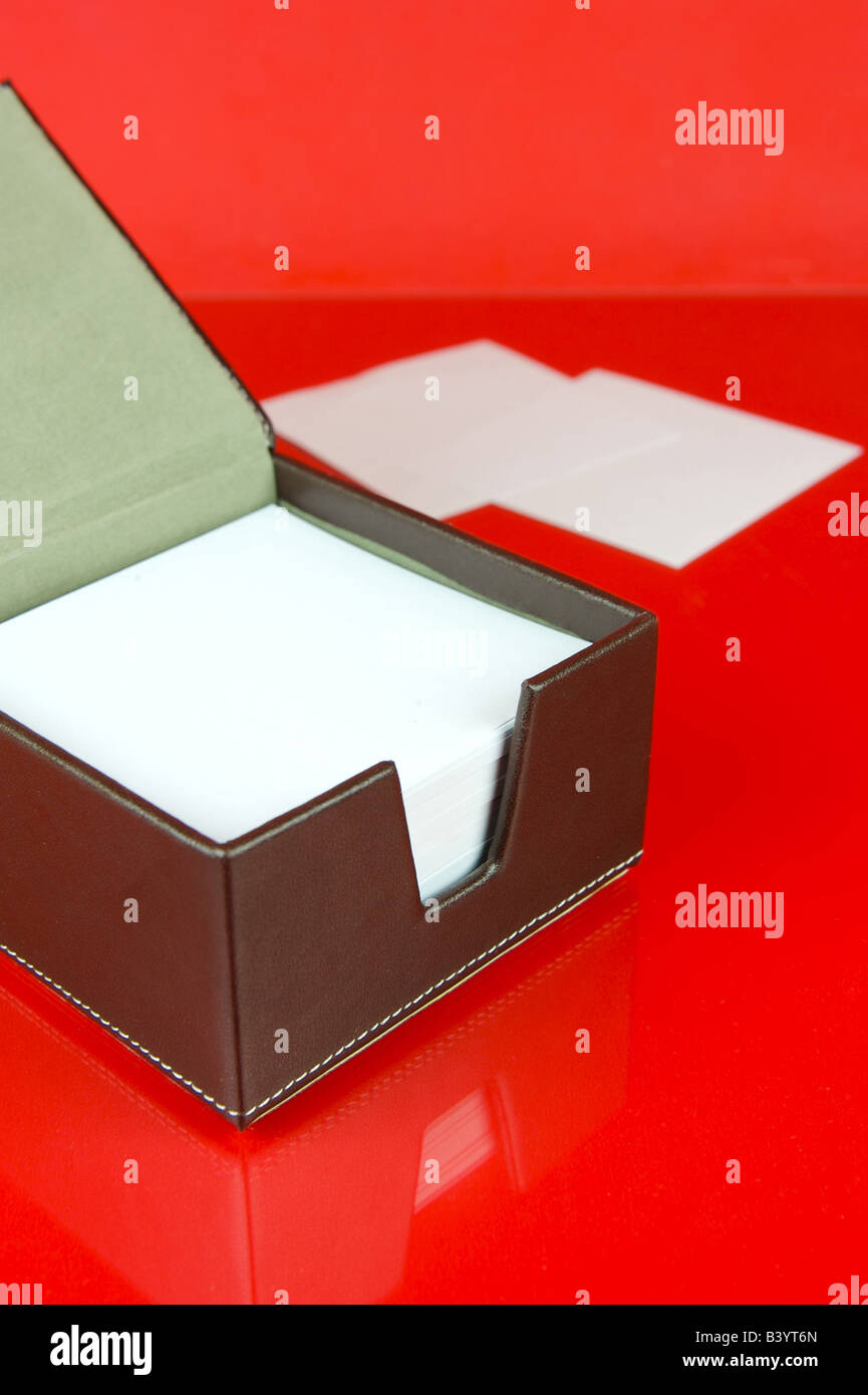 A note block isolated against a red background Stock Photo - Alamy